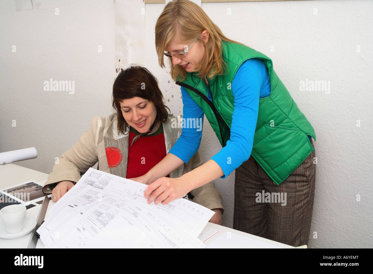Architects looking at drawings Stock Photo - Alamy