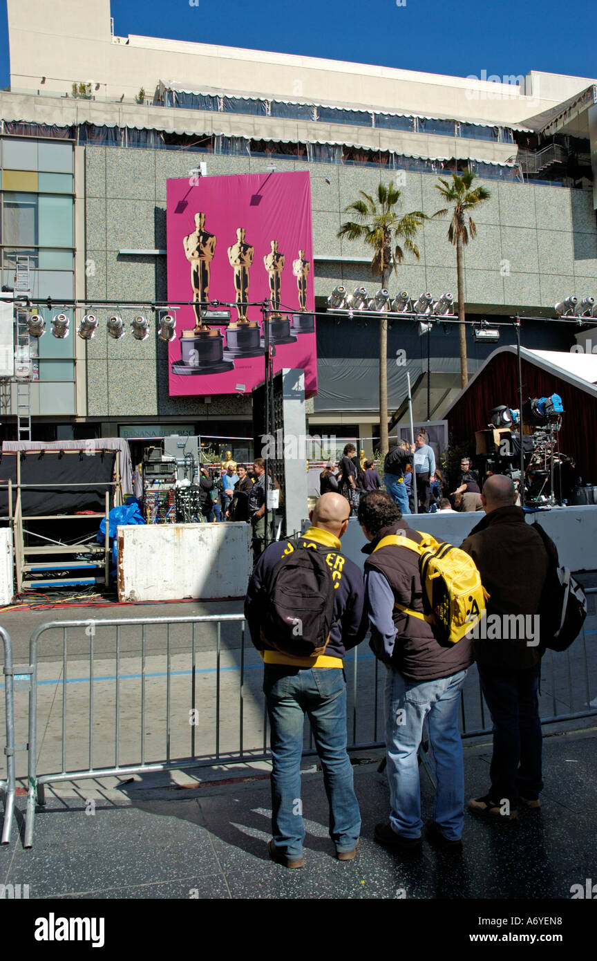 Tourists observe from the Hollywood Walk of Fame during preparations ...