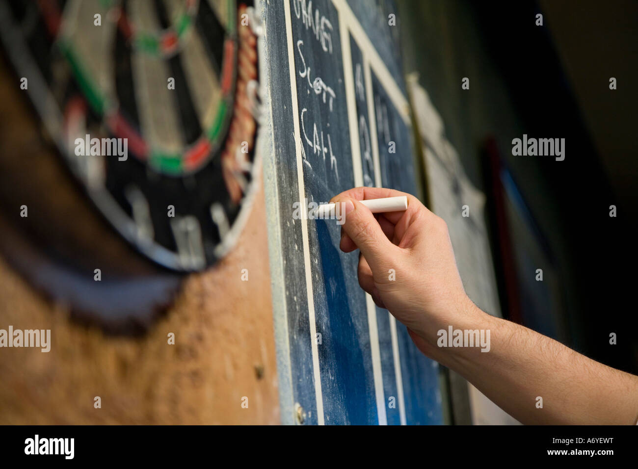 Person keeping score on a blackboard during a game of darts Stock Photo ...