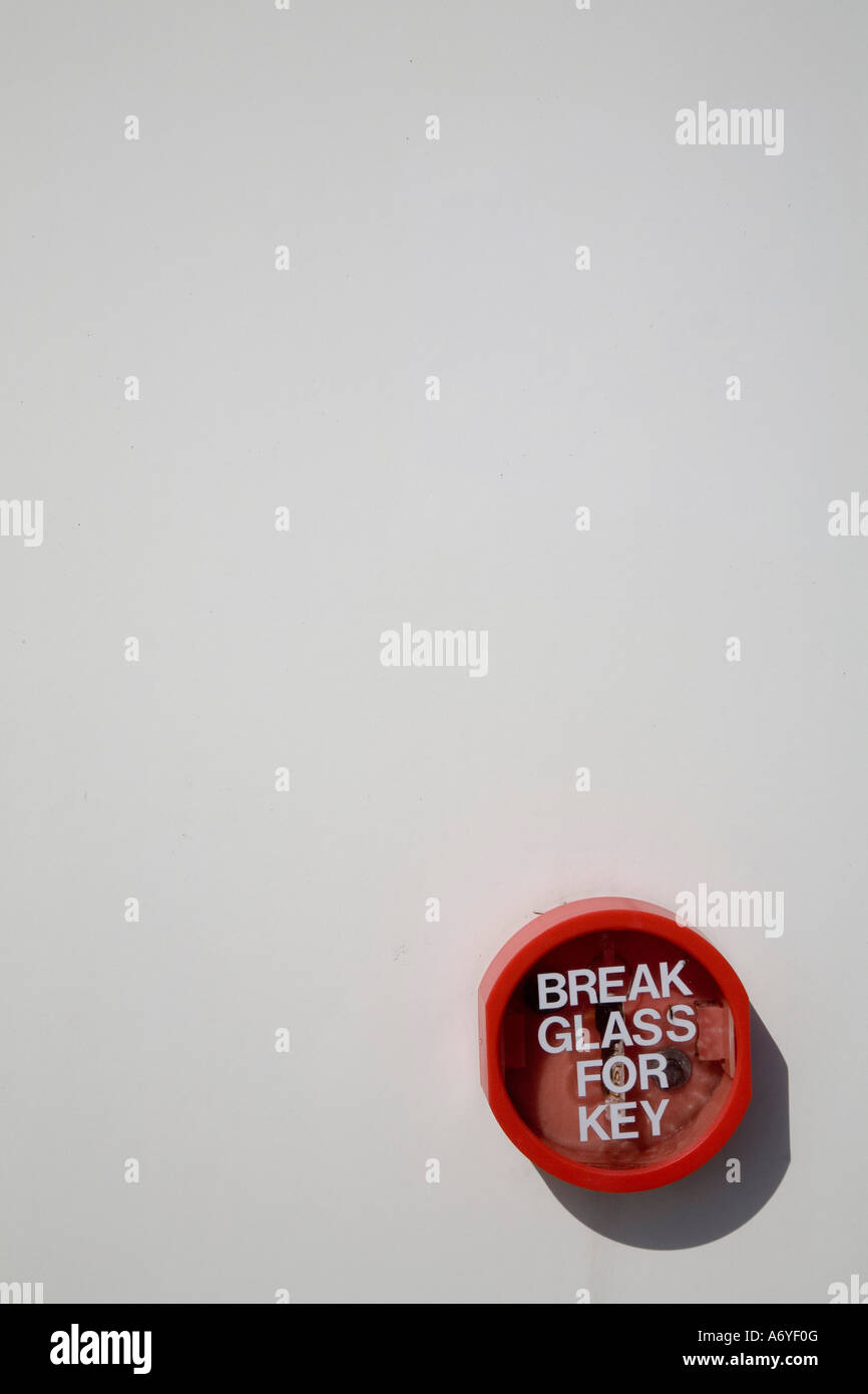 Emergency exit key on a wall Stock Photo - Alamy