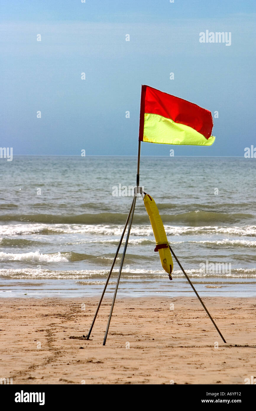 Red and yellow flag warning of a designated lifeguard watched bathing ...