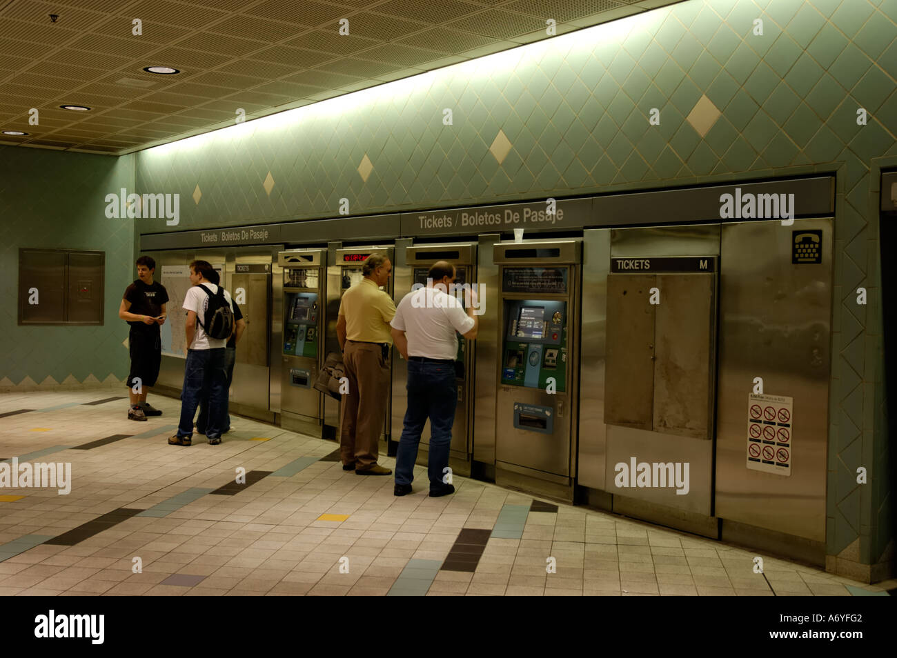 Passengers buying tickets for subway train at Hollywood and Highland ...