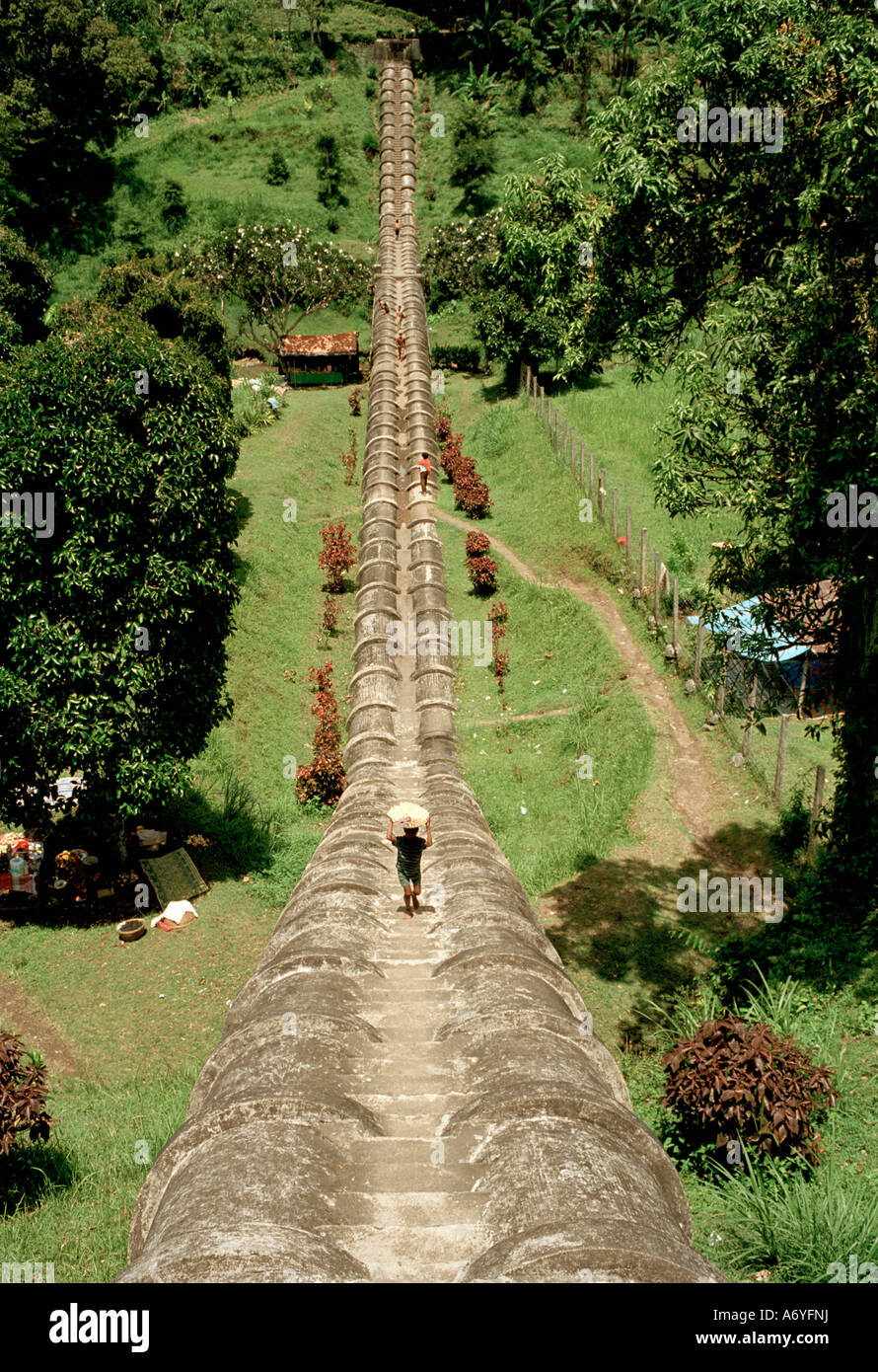 Stone aqueduct going down hillside Taman Narmada Lombok Indonesia Stock ...