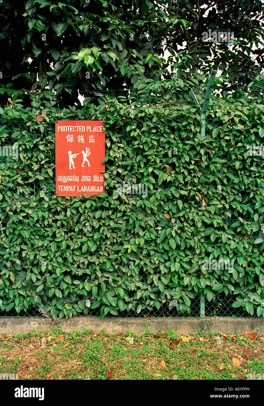 Protected Place sign on a fence Singapore Stock Photo - Alamy