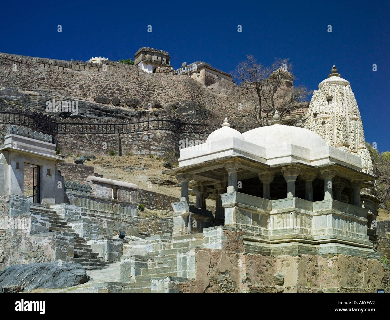 Battlement and walls of Kumbhalgarth hilltop fort with hindu temple in ...