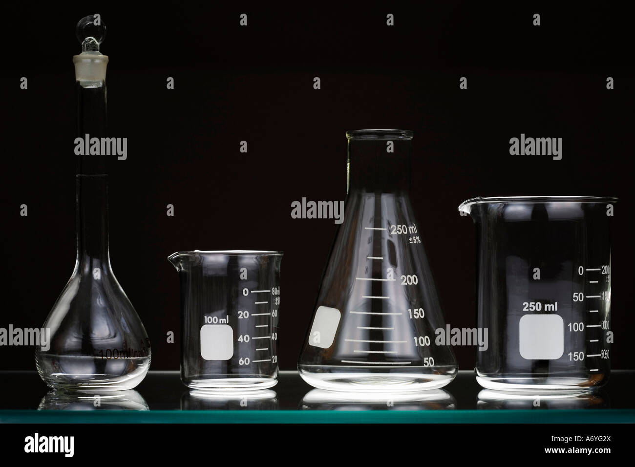 Laboratory glassware on a shelf Stock Photo - Alamy