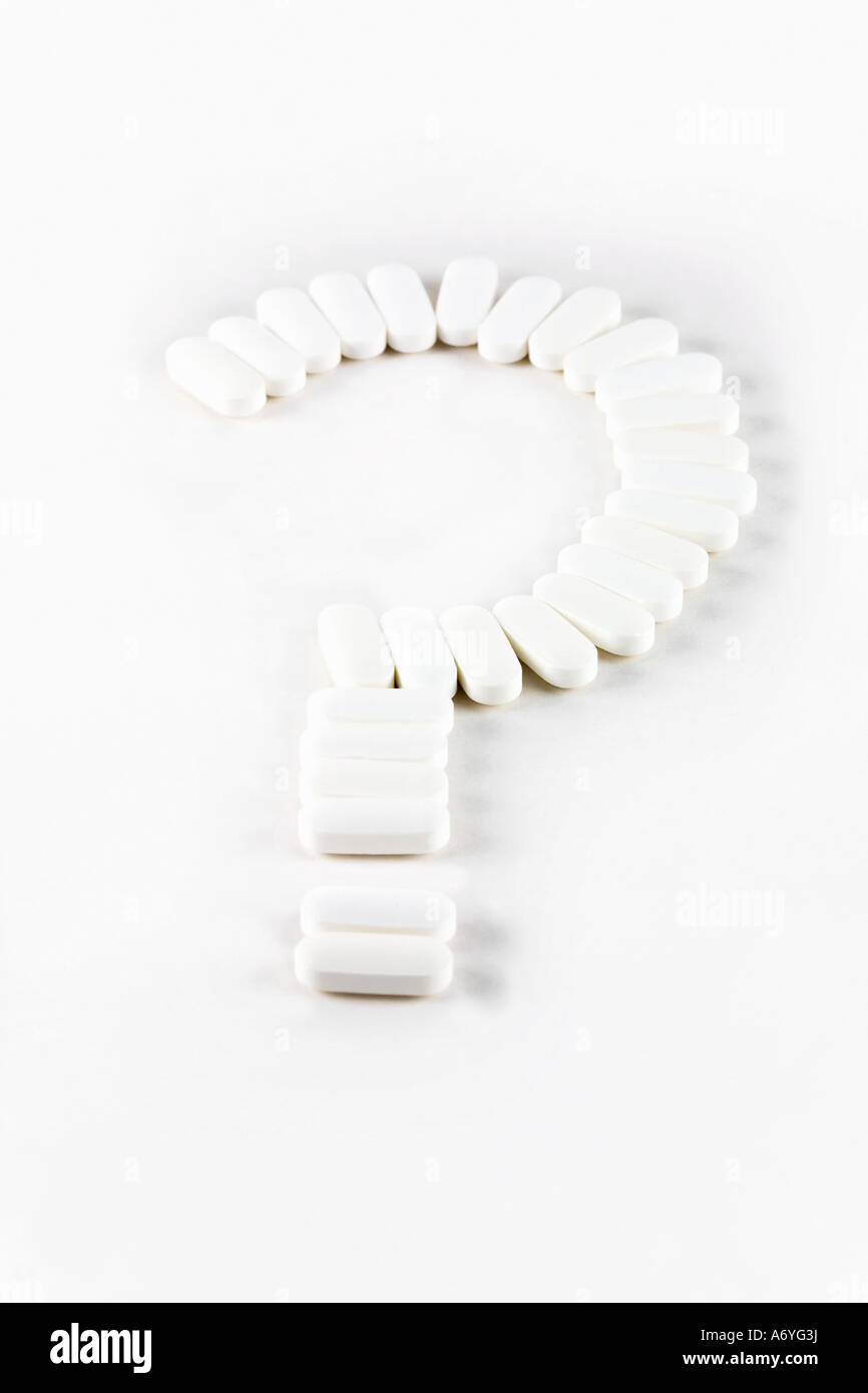 White tablets used to make a question mark Stock Photo - Alamy