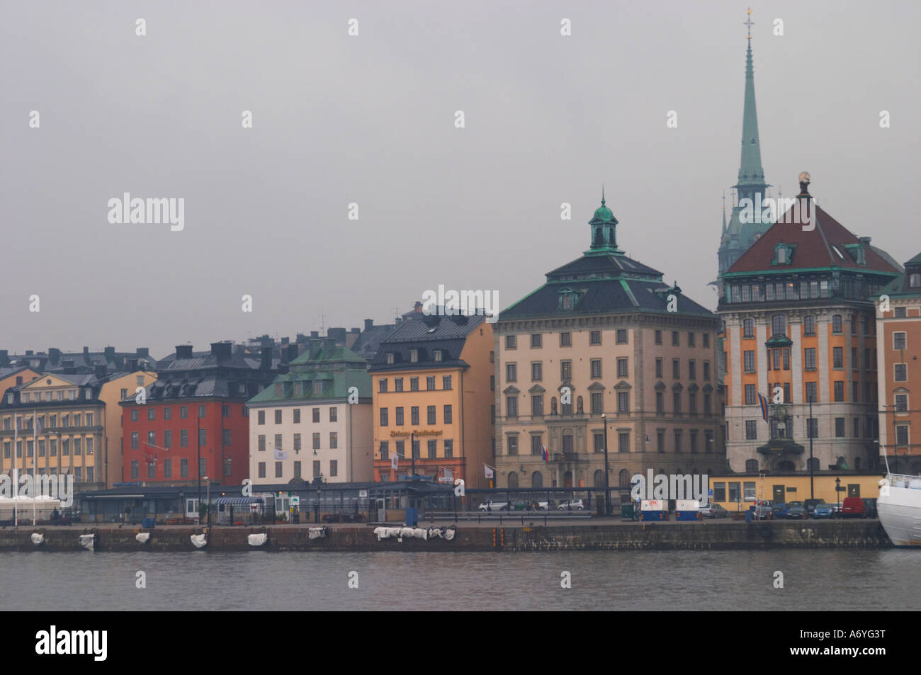 The water front at Gamla Stan, The Old Town, Skeppsbron, in foggy ...
