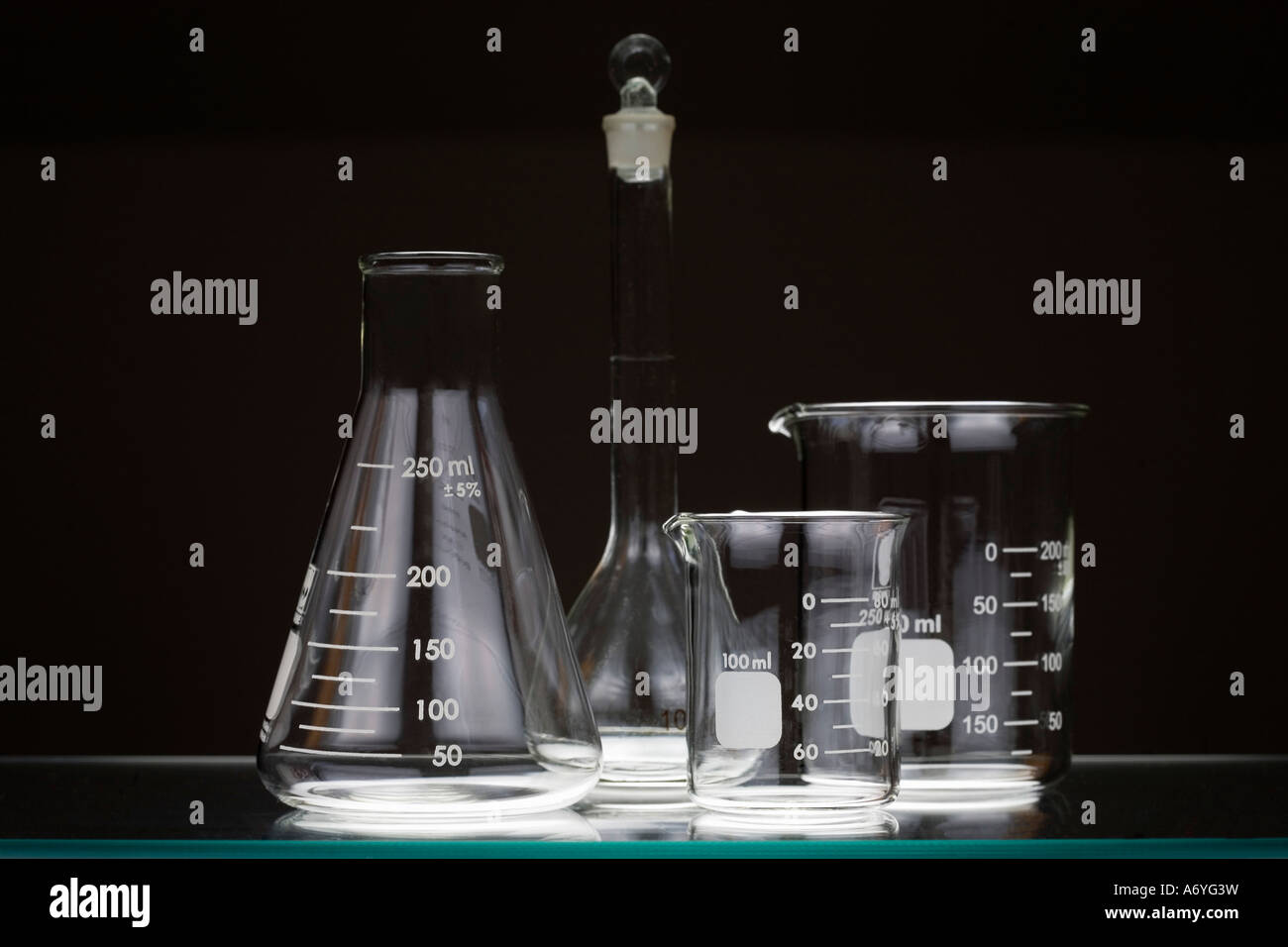 Laboratory glassware on a shelf Stock Photo - Alamy