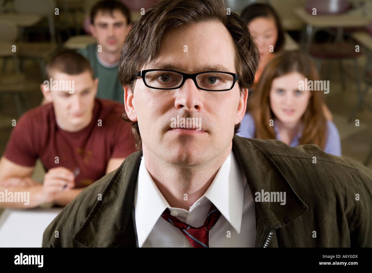 Lecturer standing in front of students Stock Photo - Alamy