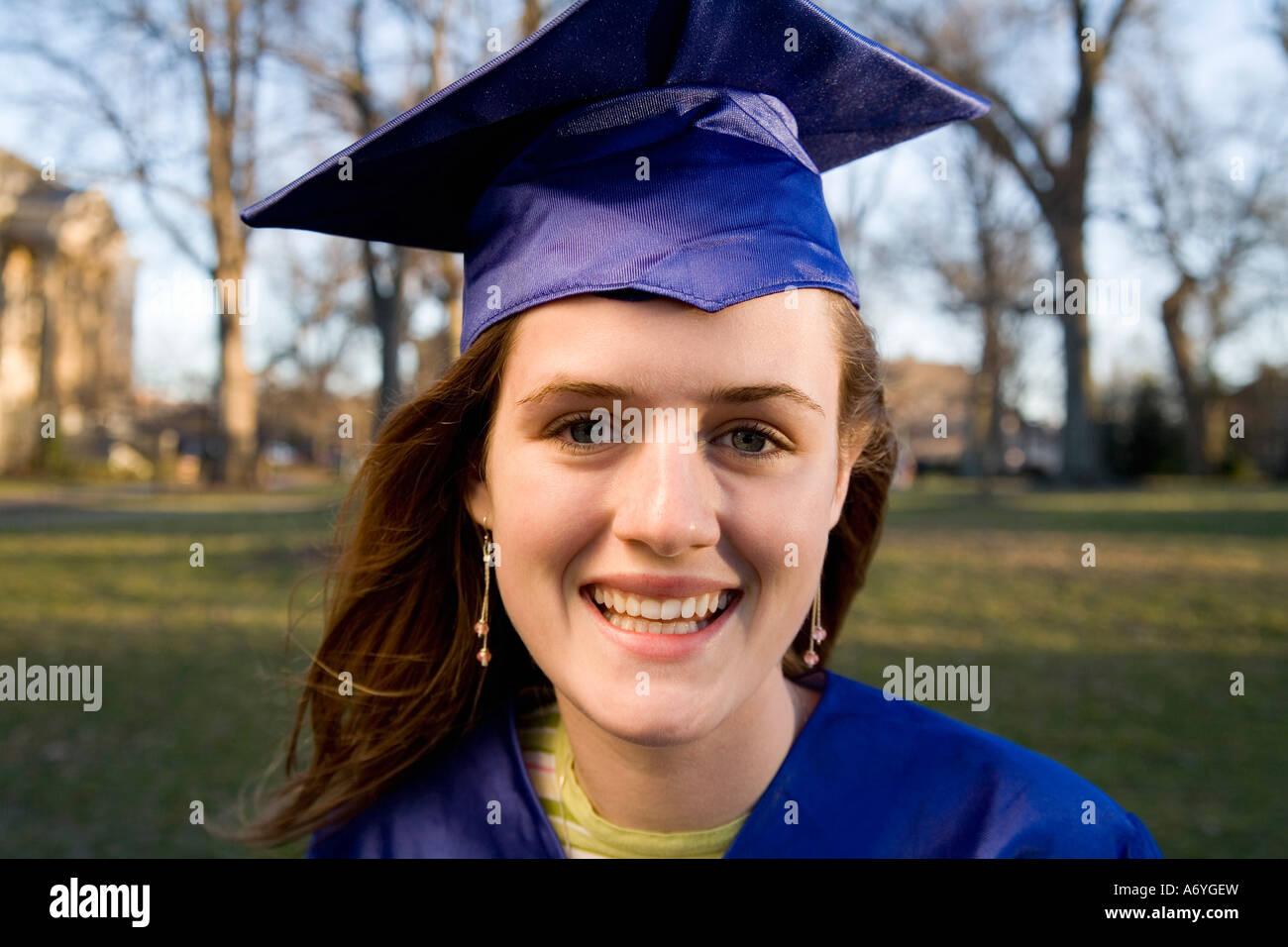 Portrait of a woman in a graduation gown and mortar board Stock Photo ...