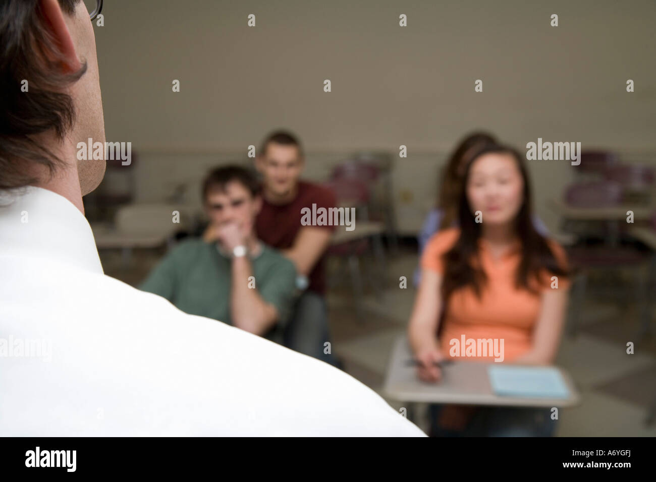 Lecturer standing in front of students Stock Photo - Alamy