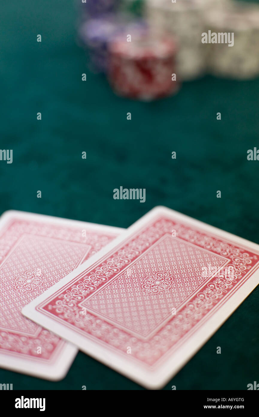 Two playing cards and piles of gambling chips on a table Las Vegas ...