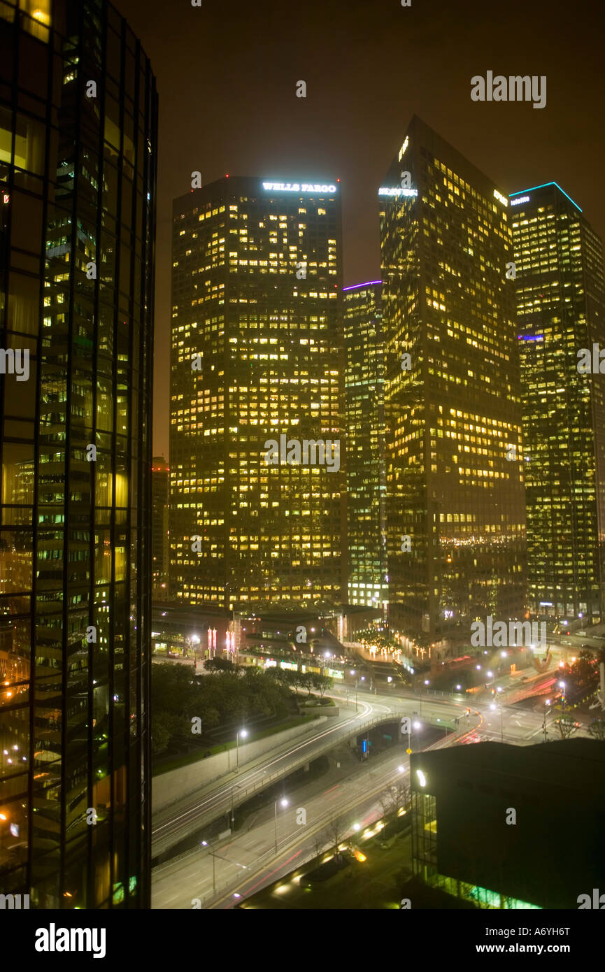 Illuminated skyscrapers and highway at night Los Angeles California ...