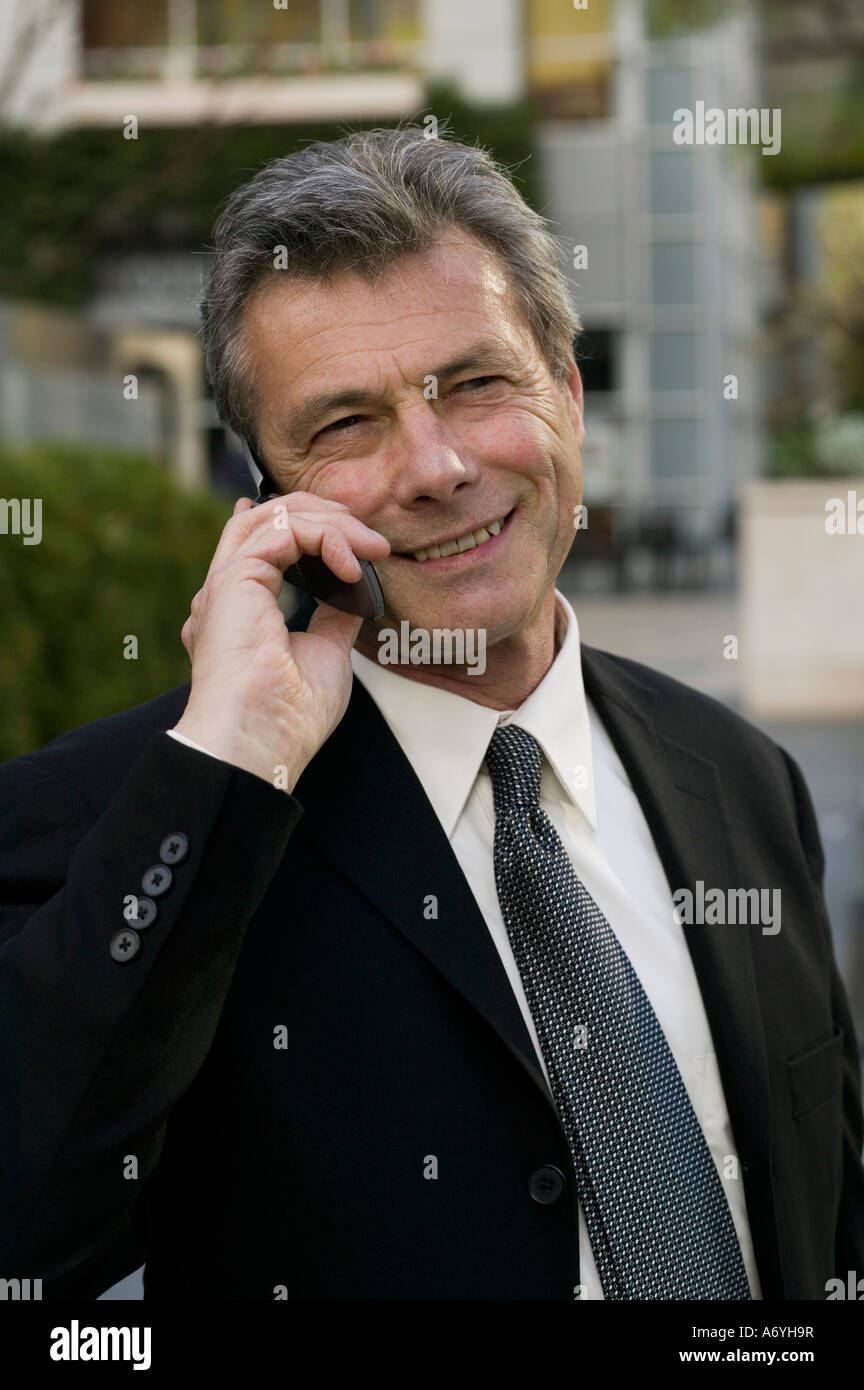 Businessman using a mobile phone Stock Photo - Alamy