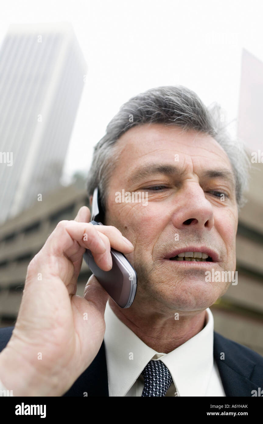 Businessman using a mobile phone Stock Photo - Alamy