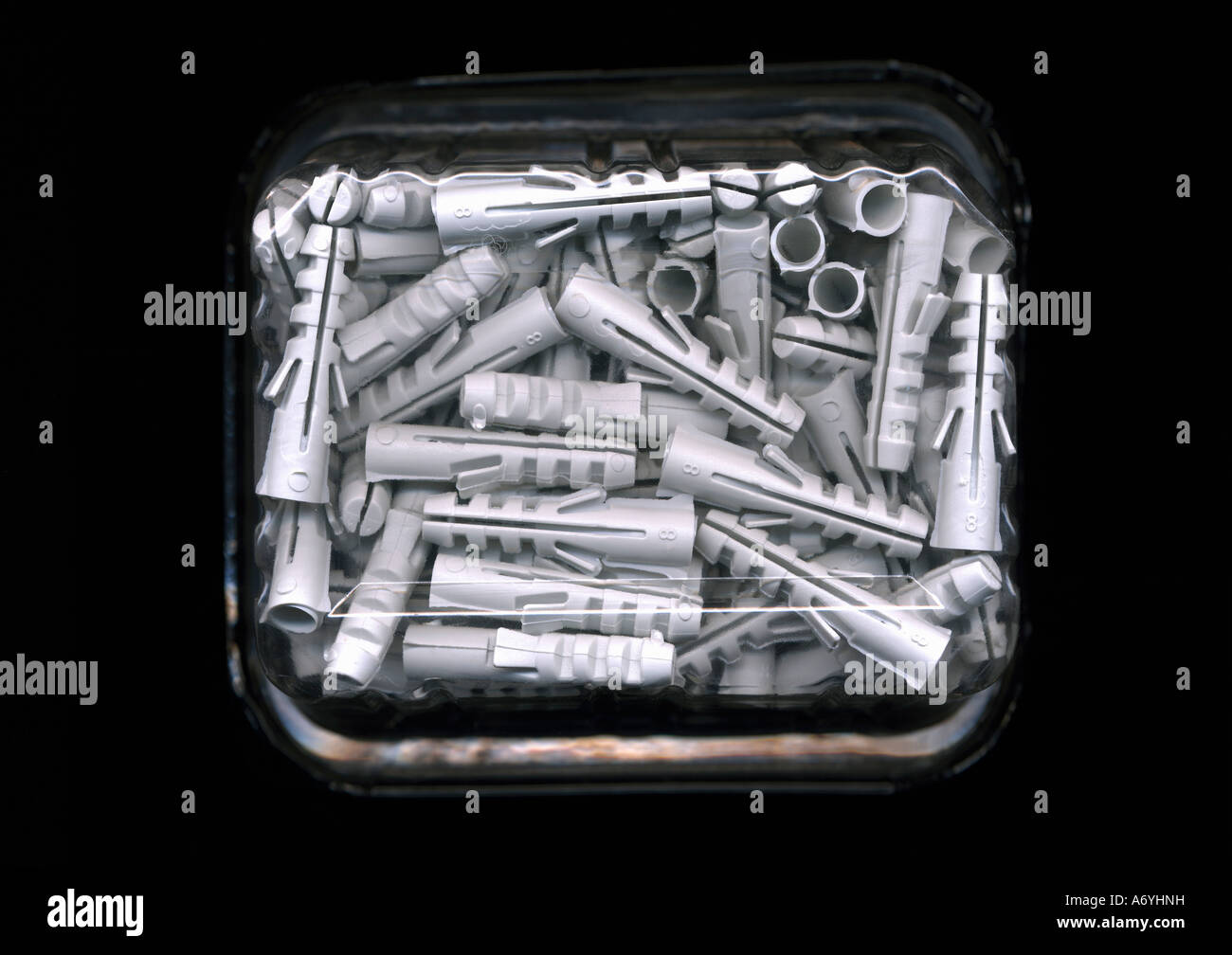 Packet of plastic wall plugs Stock Photo - Alamy