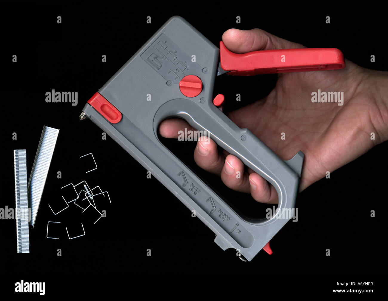 Man holding a staple gun Stock Photo - Alamy