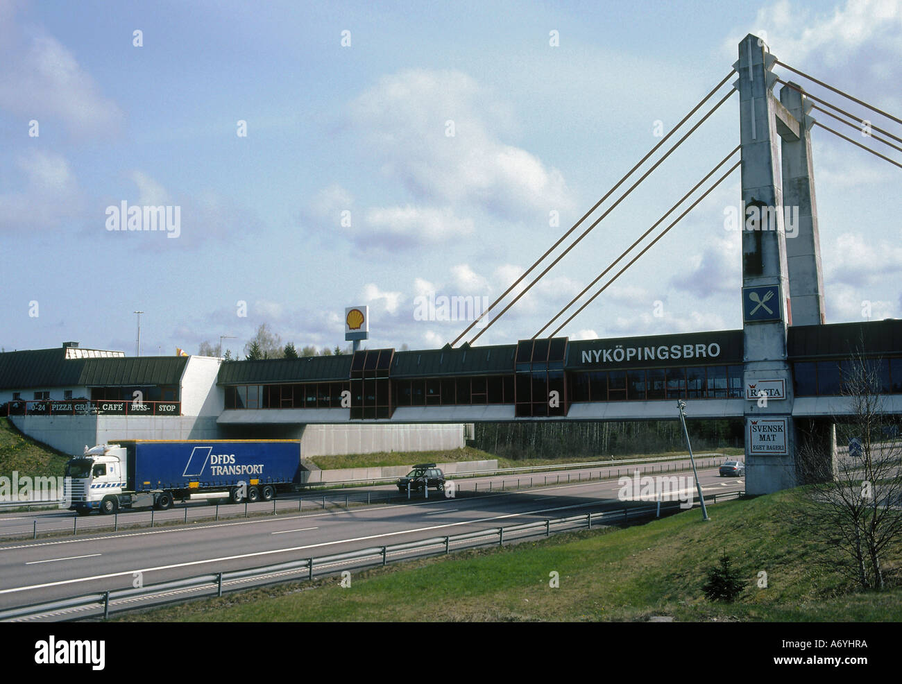 A combined rest area, restaurant, bridge, that spans the freeway or ...