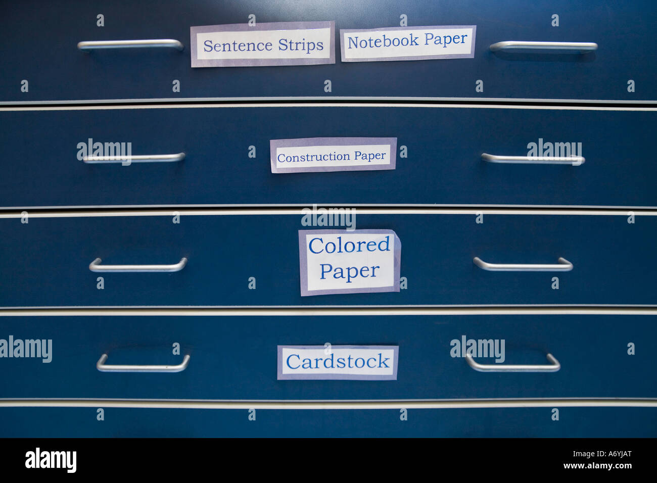 A blue chest of drawers in a classroom Stock Photo - Alamy
