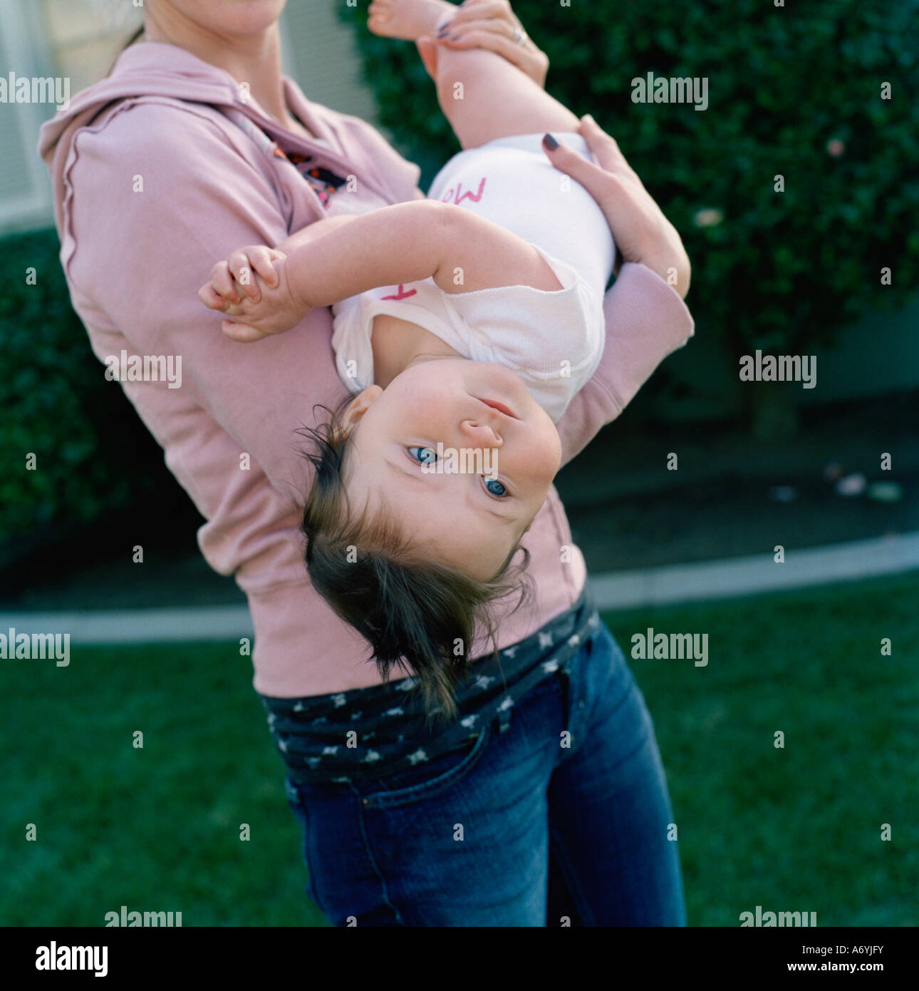 Mother carrying baby girl Stock Photo - Alamy Mother carrying baby girl Stock Photo - Alamy