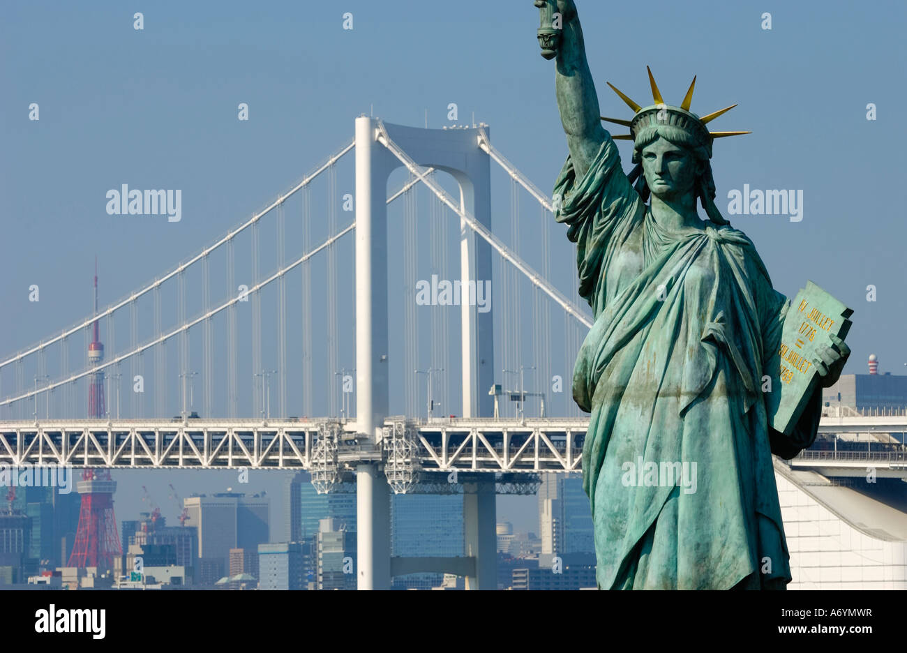 A copy of the Statue of Liberty in front of the Rainbow Bridge and of ...