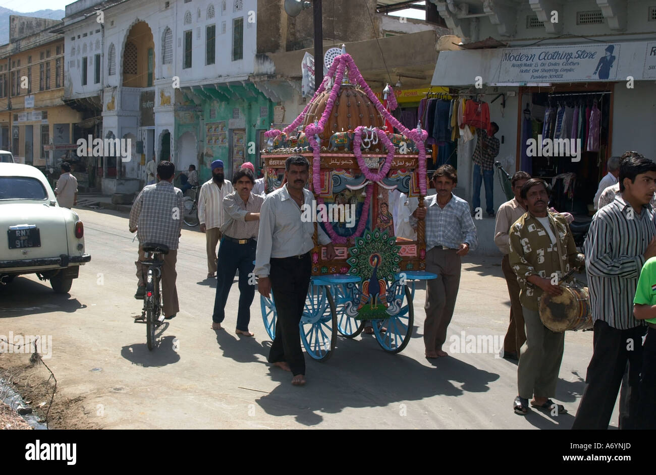 A religious procession through the village streets of Pushkhar, India ...