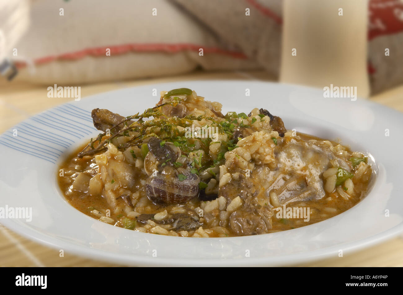 Rabbit with snails and rice Stock Photo - Alamy