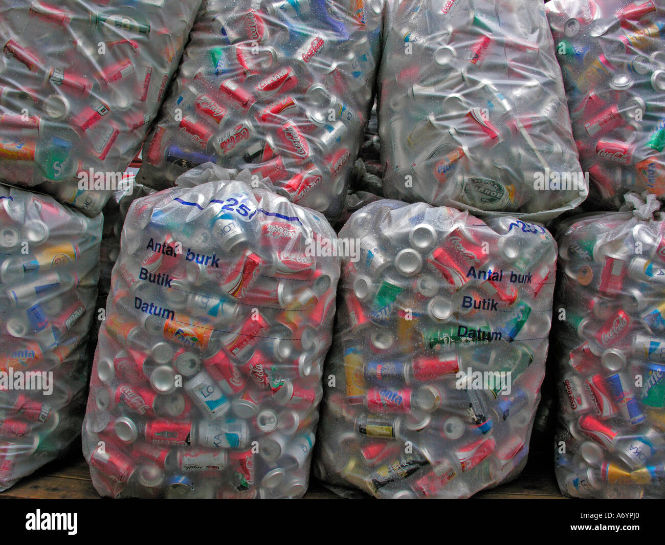 collected beverage tins cans in plastic sacks for recycling Stock Photo ...