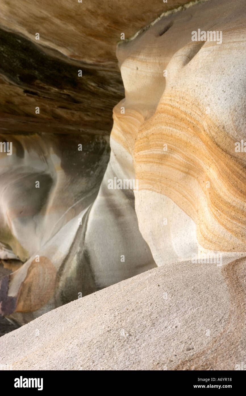 Round brown and grey sandstone rocks with a wave pattern Stock Photo ...