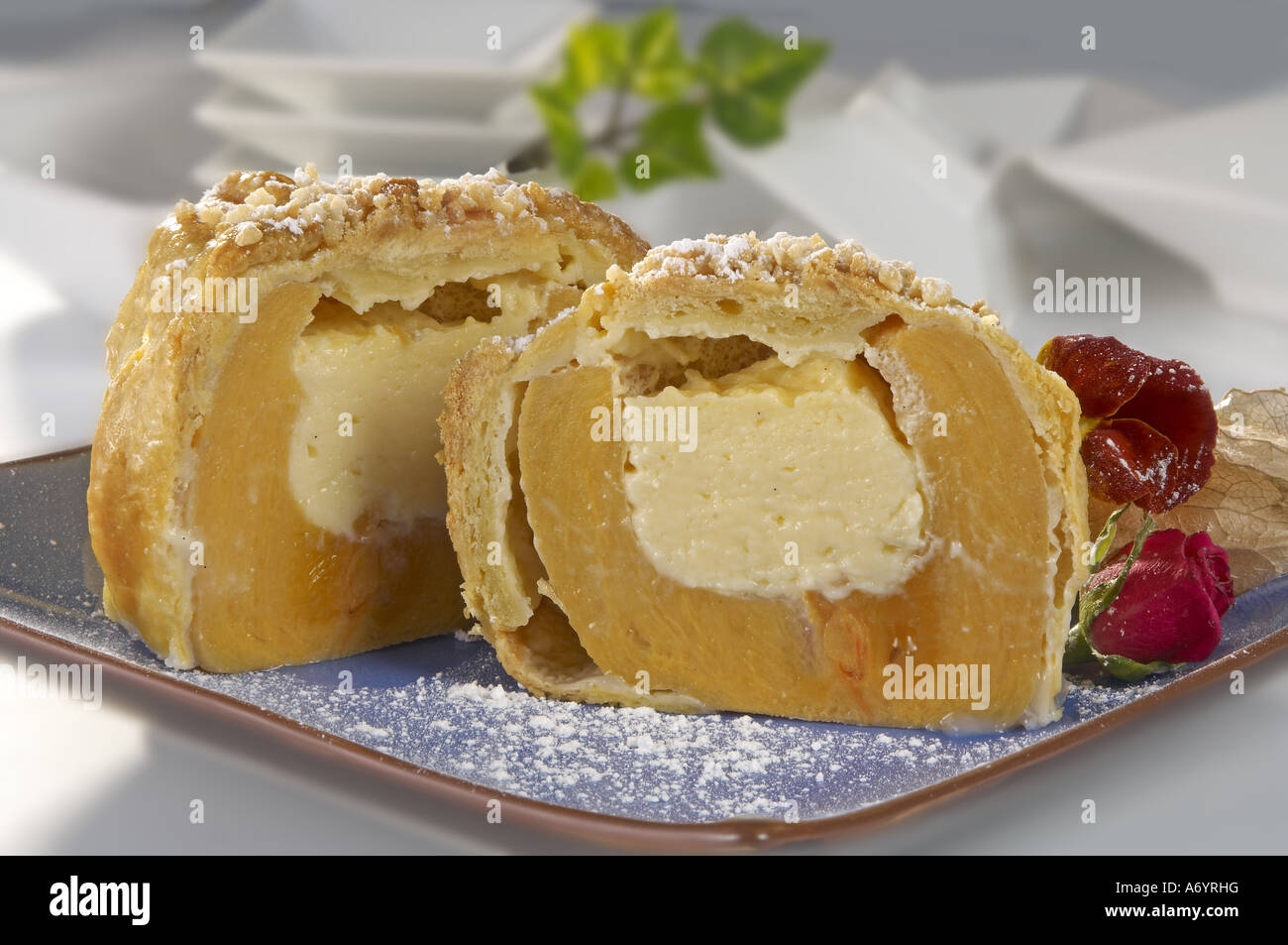 Kaki persimon puff pastry with crème patisserie Stock Photo - Alamy