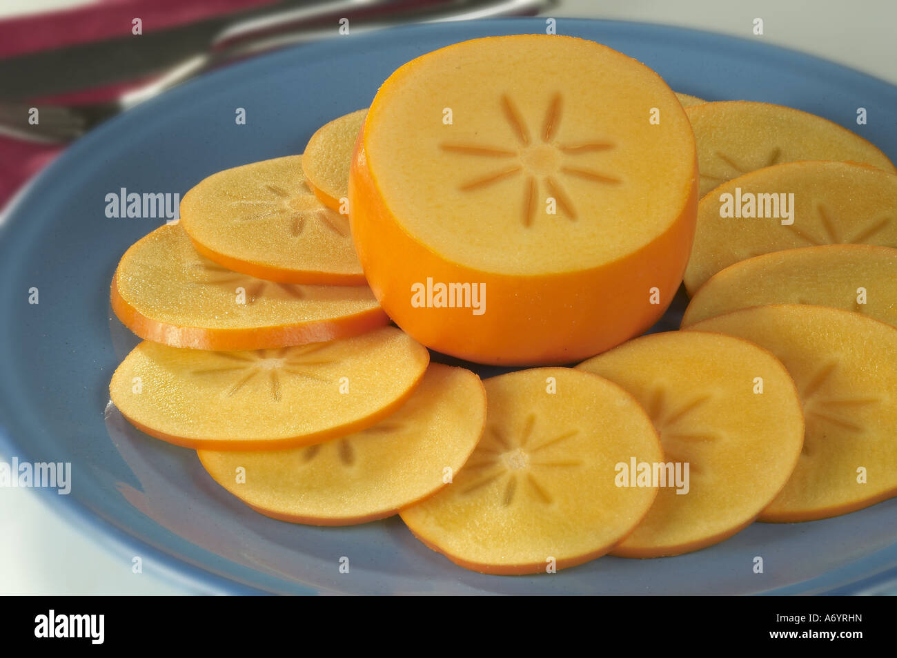 Sliced kaki persimon Stock Photo - Alamy