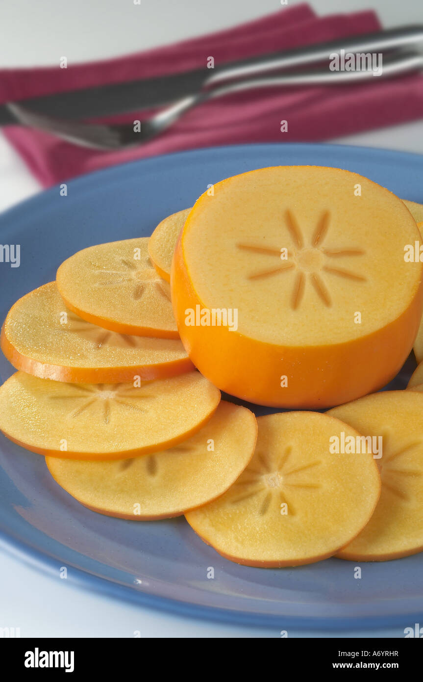 Sliced kaki persimon Stock Photo - Alamy