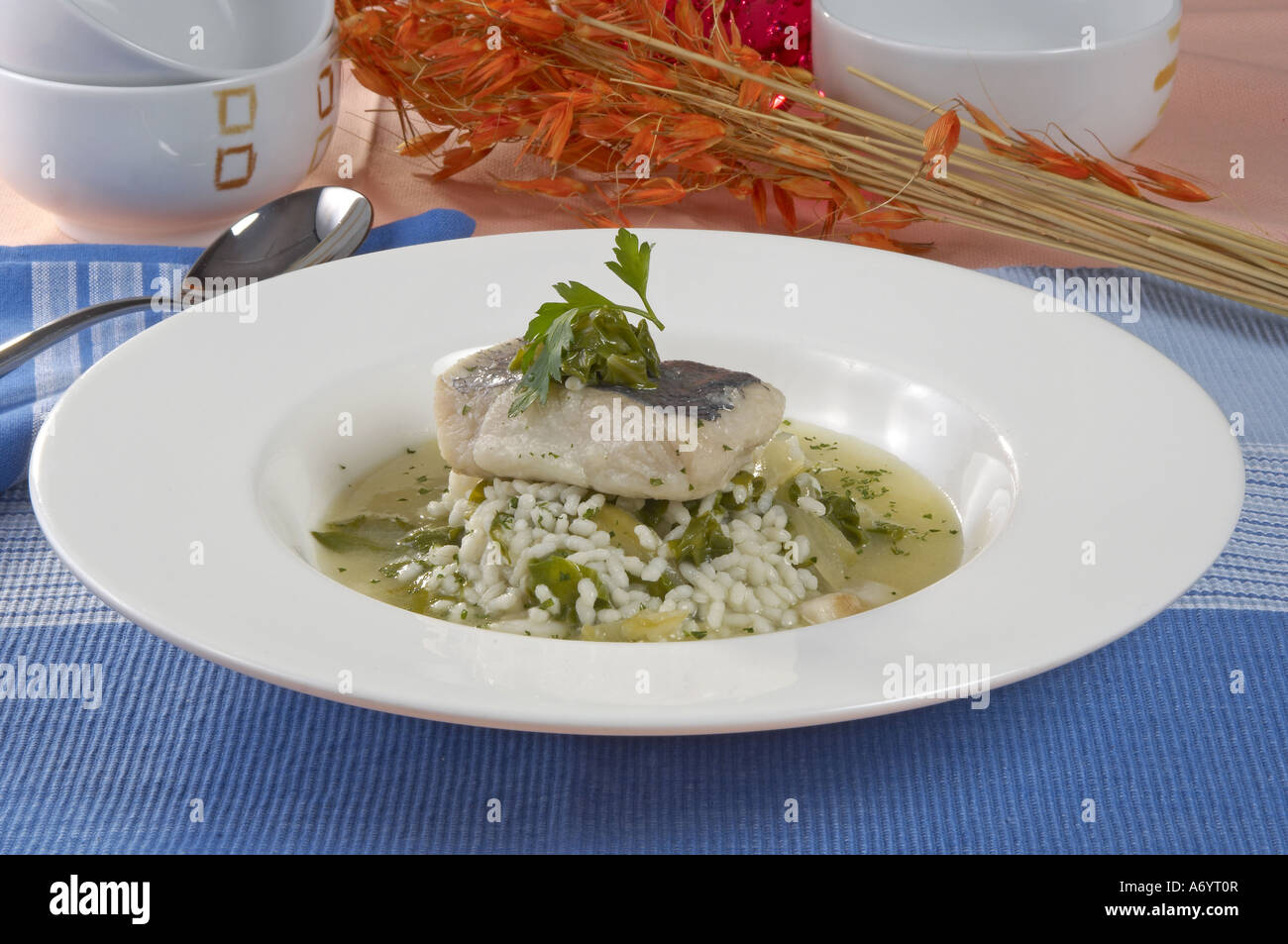 Hake fillet with rice and chard soup Stock Photo - Alamy