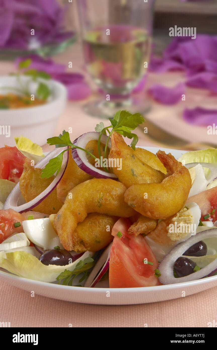 Prawns battered with garlic and parsley with romesco sauce and green ...