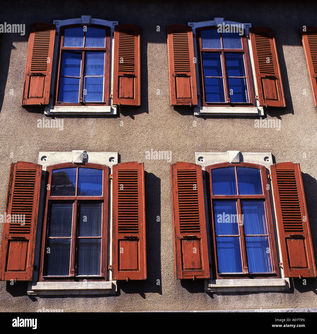 Building with shutters on windows in Thun Switzerland Stock Photo - Alamy