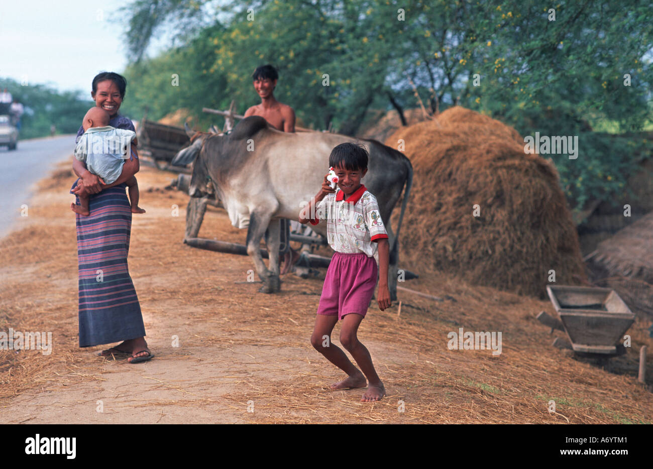 Local Burmese boy and family photographed en route to Mandalay from ...