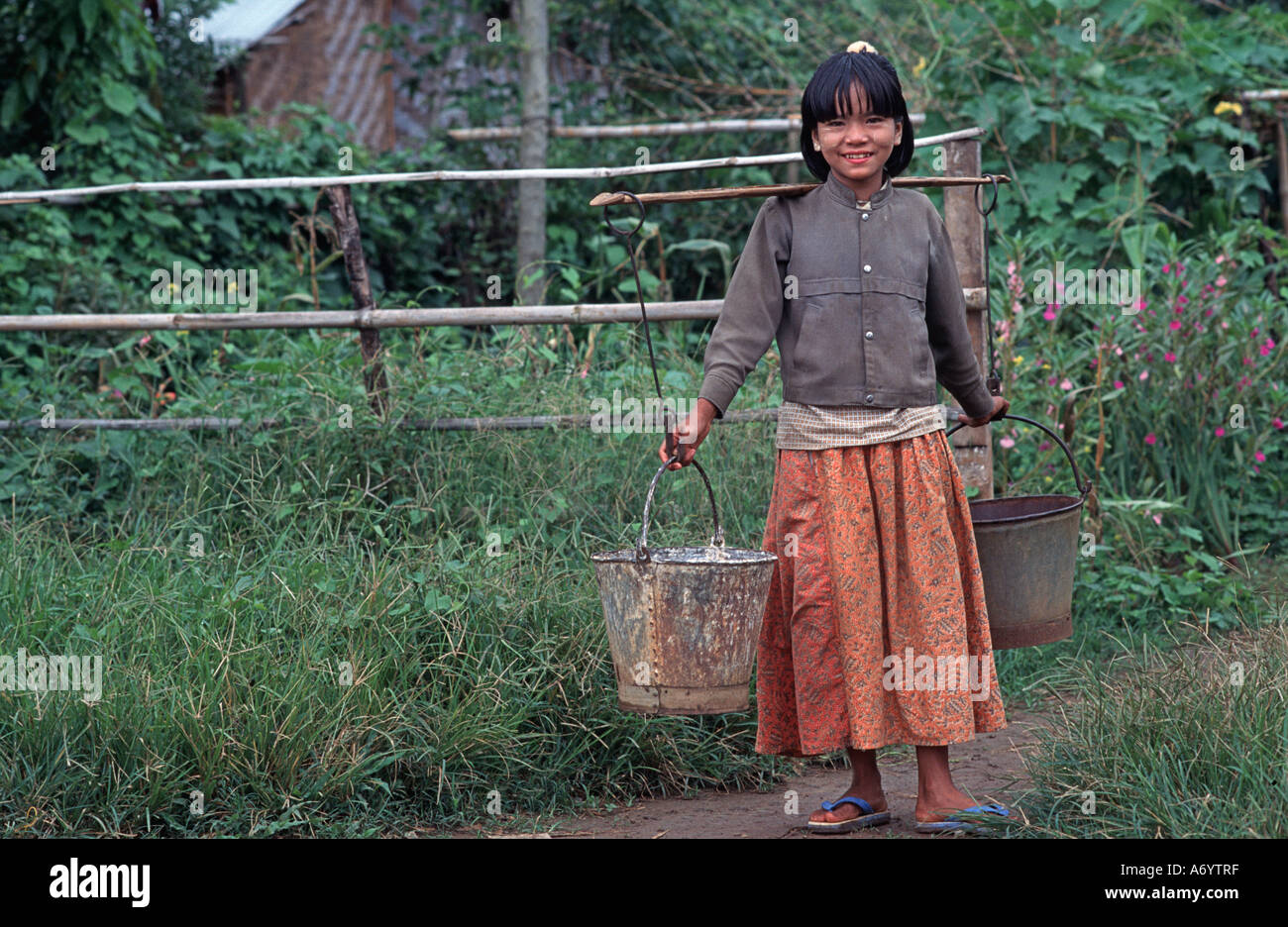 Friendly burmese girl carrying buckets of water Pyin U Lwin Maymyo ...