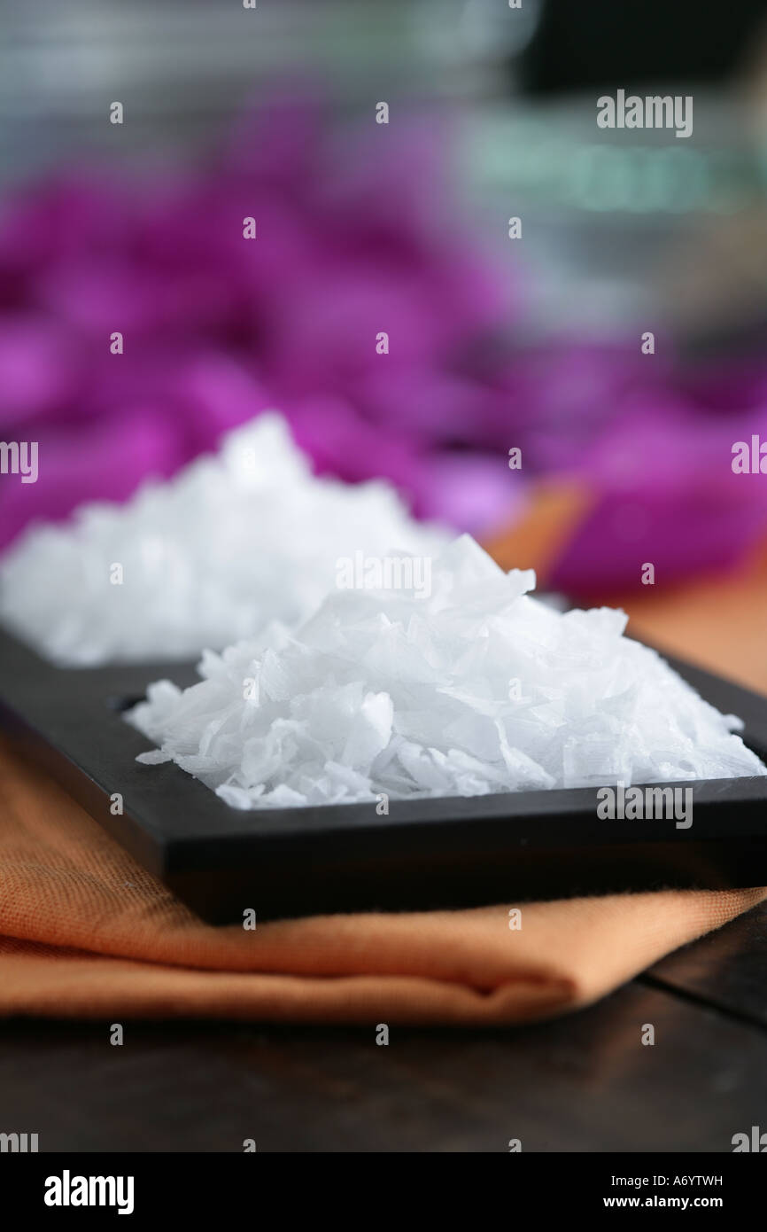 Crystal salt on white square plates Stock Photo - Alamy