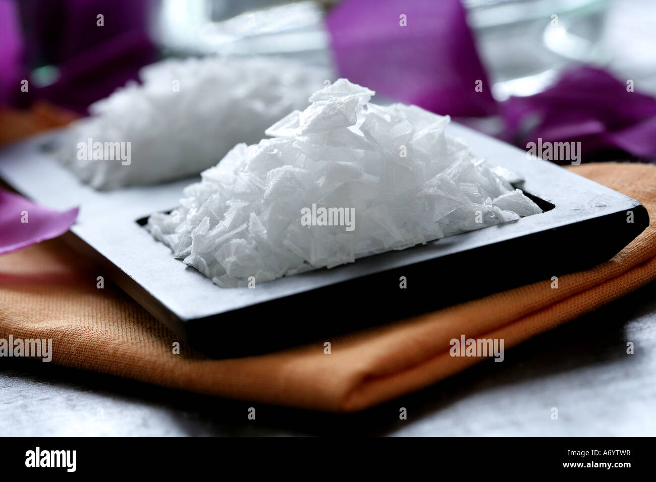 Crystal salt on white square plates Stock Photo - Alamy