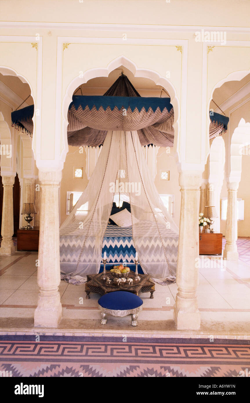 Traditional Rajput columns and cuspid arches in tented guest bedroom ...