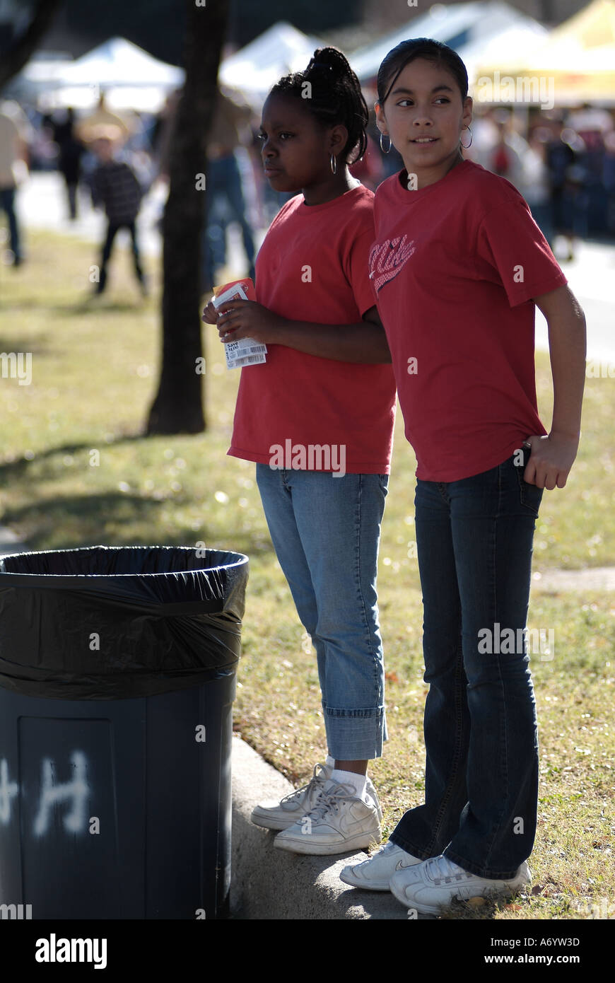 Two young girls standing up Stock Photo - Alamy