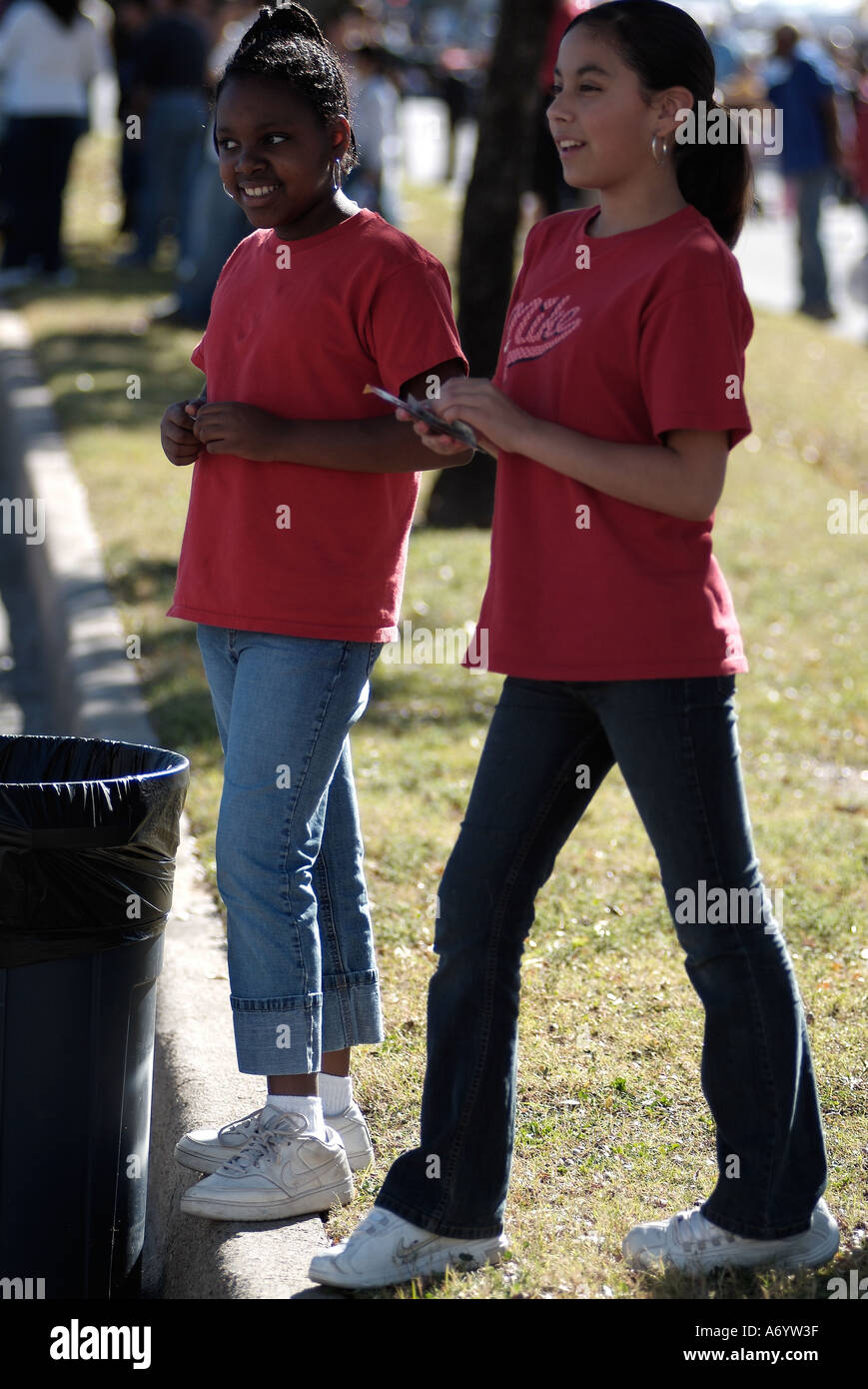 Two young girls standing up Stock Photo - Alamy