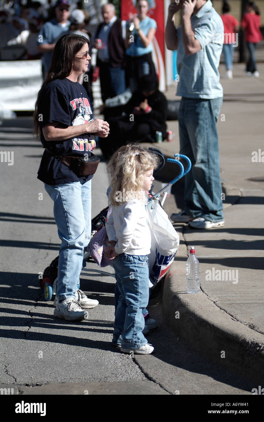 Young girl and her mother standing up Stock Photo - Alamy