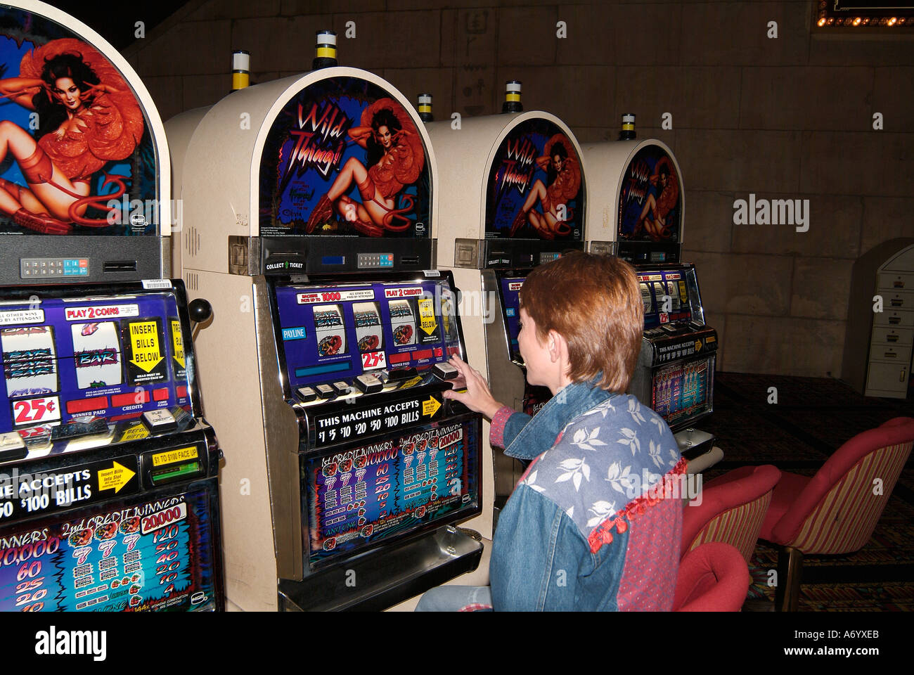 Woman using slot machine hi-res stock photography and images - Alamy