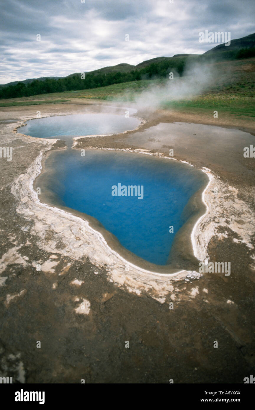 Hot water pools in this area of geothermal activity Geysir Iceland ...