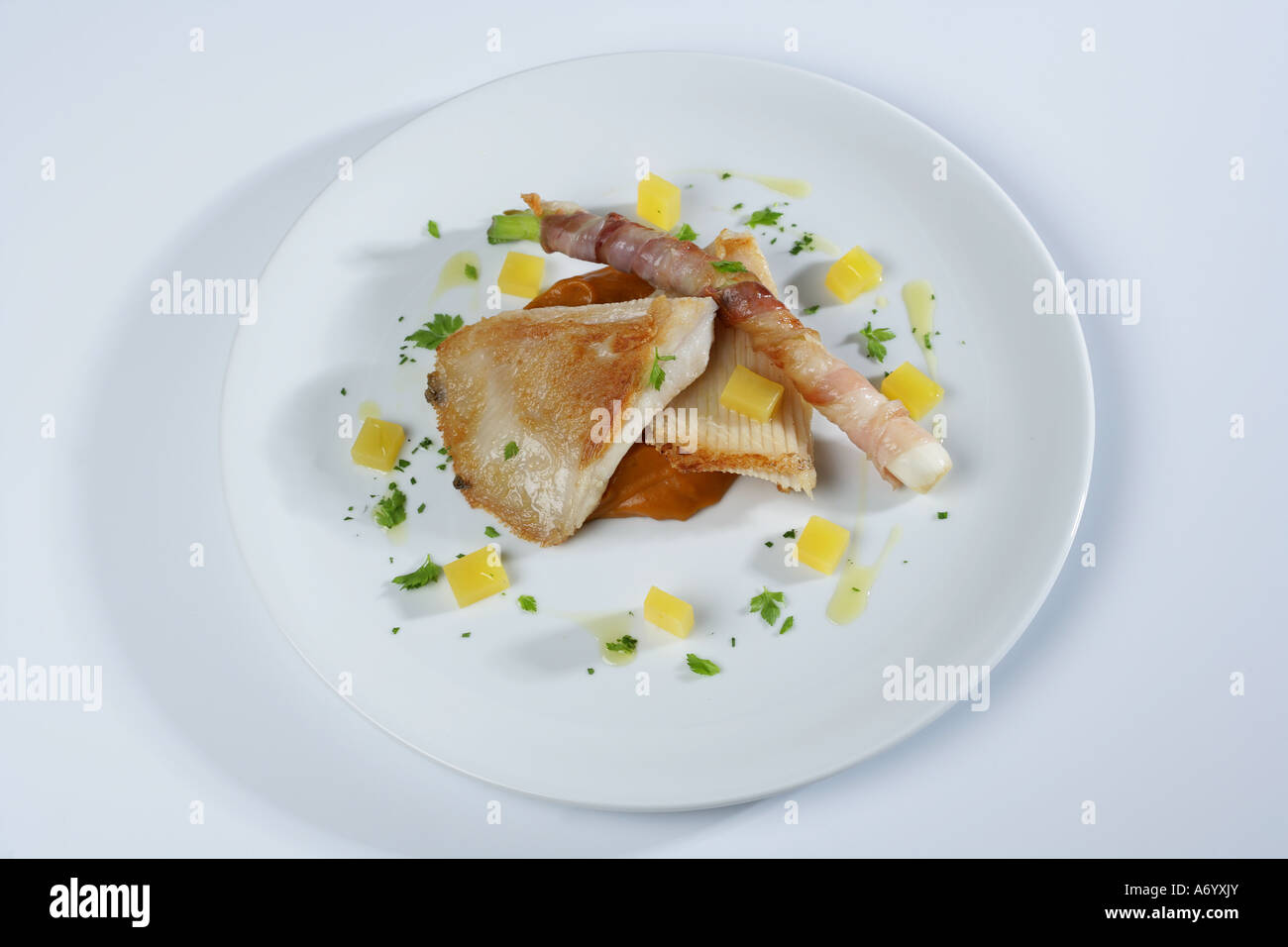 Ray with sweet potato spring onions and orange Stock Photo - Alamy