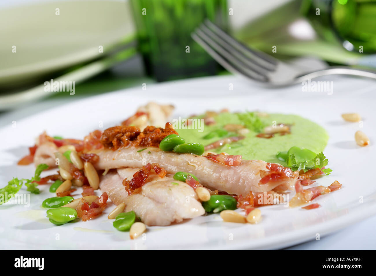 Sole fish with tender broad beans with sea urchin roe Stock Photo - Alamy