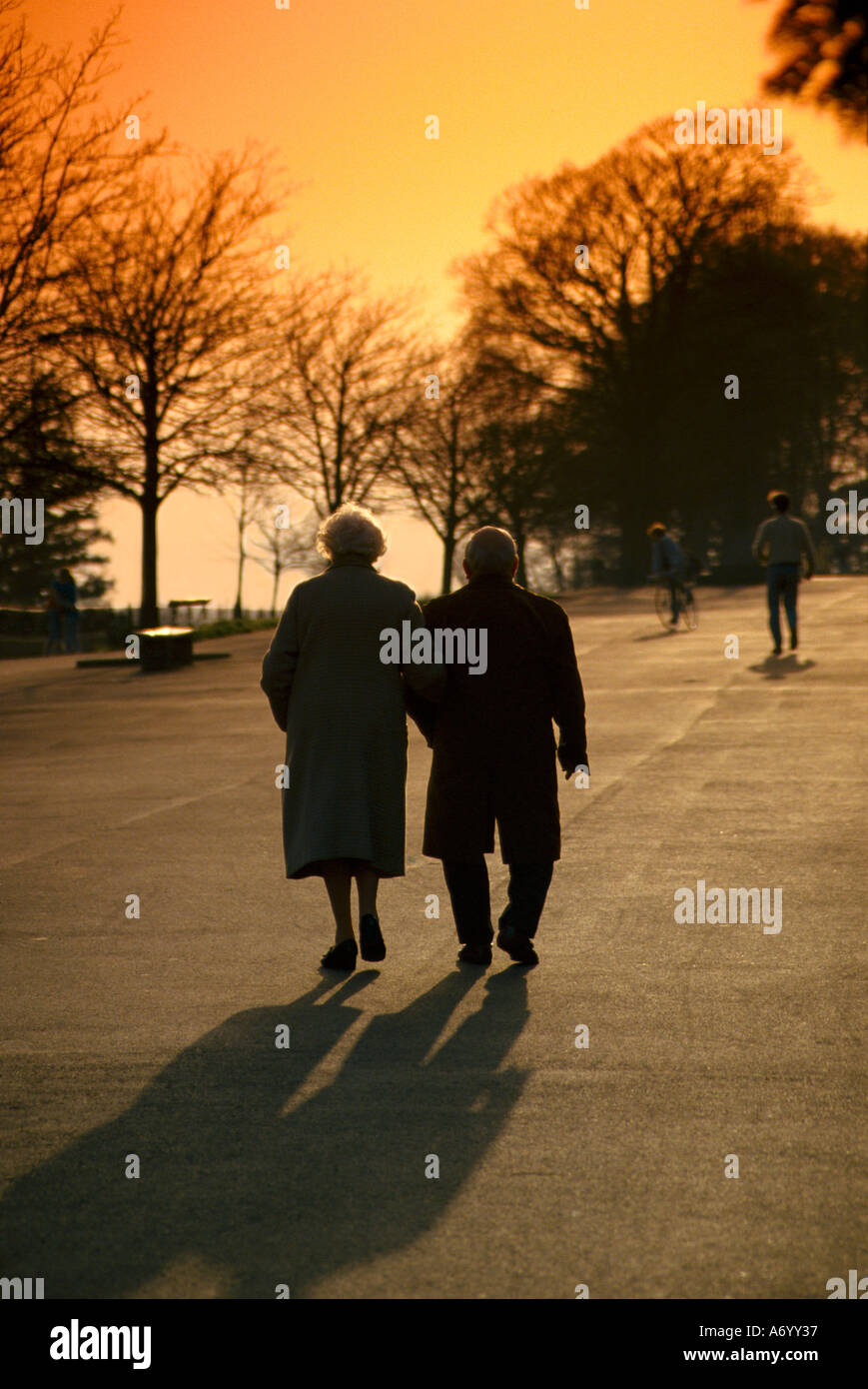 Elderly couple without walking aids take a stroll along the Promenade ...