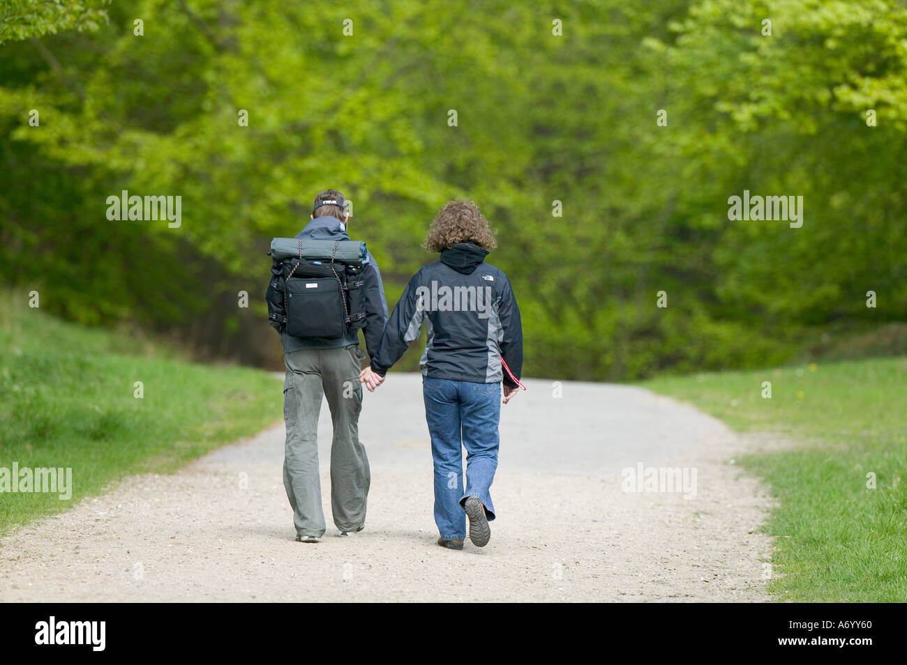 Walking hand in hand Stock Photo - Alamy